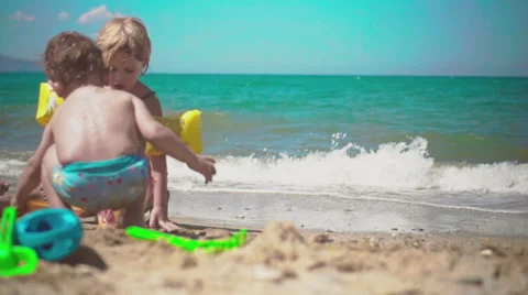 Cute Kids Having Fun on Beach and Playin... | Stock Video | Pond5