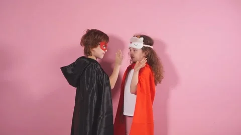 Cute kids in superhero costumes pose in ... | Stock Video | Pond5