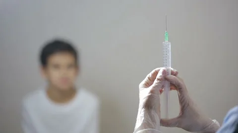 Cute little boy afraid of injection. nur... | Stock Video | Pond5