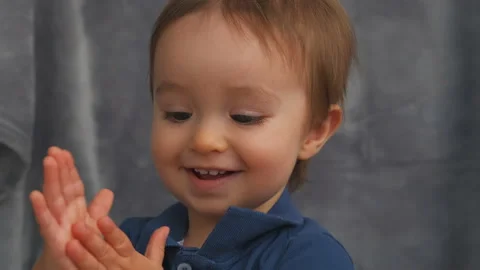The cute little boy clapping hands. slow... | Stock Video | Pond5