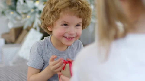 Cute Little Boy Receiving Christmas Pres... | Stock Video | Pond5