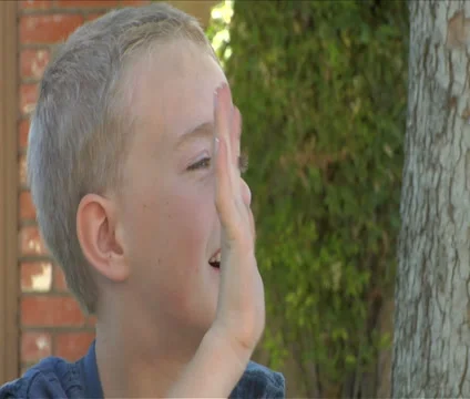 Cute little boy waves Goodbye, then pick... | Stock Video | Pond5