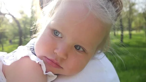 Cute little child girl face portrait hol... | Stock Video | Pond5