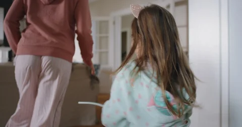 cute little girl chasing mother with wat... | Stock Video | Pond5