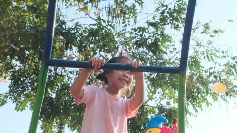 Cute little girl climbing on ladder in p... | Stock Video | Pond5