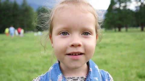 Cute little girl face portrait happily l... | Stock Video | Pond5