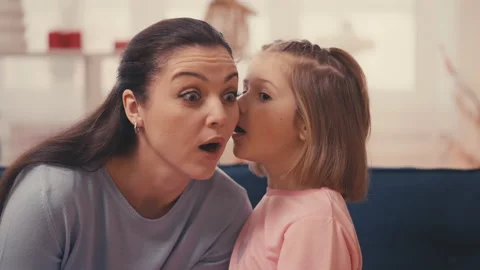 Cute little girl sharing secrets with mo... | Stock Video | Pond5