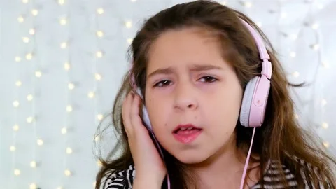 Cute little girl singing and dancing wit... | Stock Video | Pond5