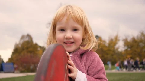 Cute little girl swing up and down | Stock Video | Pond5