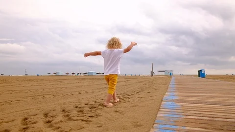 Cute little girl walking funny on the hu... | Stock Video | Pond5