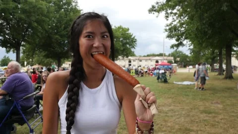 Cute Native American Indian Corn Dog Gir... | Stock Video | Pond5