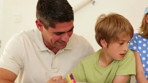 Cute parents and children colouring toge... | Stock Video | Pond5