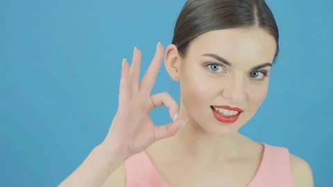 Cute Playful Woman is Showing Ok Sign on... | Stock Video | Pond5