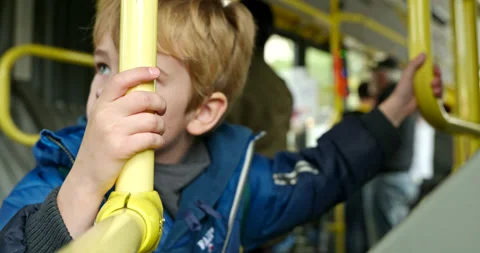 Cute Schoolchild Kid Boy Rides Bus City ... | Stock Video | Pond5
