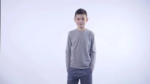 Cute smiling happy little boy isolated o... | Stock Video | Pond5