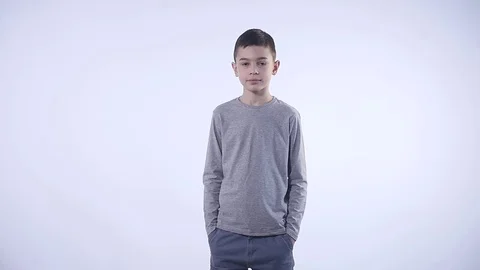 Cute smiling happy little boy isolated o... | Stock Video | Pond5