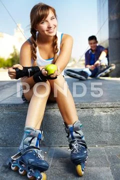 Cute teenage girl looking at camera in park with her friend on background ~ Hi Res #21321118