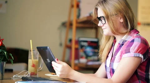 Cute teenage girl with tablet computer s... | Stock Video | Pond5