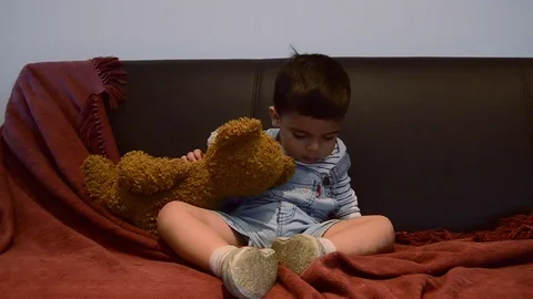 Cute tired toddler falling asleep on the... | Stock Video | Pond5