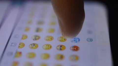 cute yellow emoticon on the iphone keybo... | Stock Video | Pond5