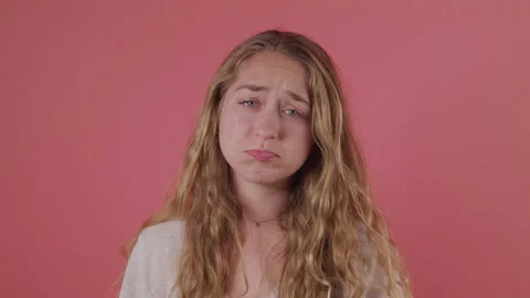 Cute Young Woman Making a Sad Face in Fr... | Stock Video | Pond5