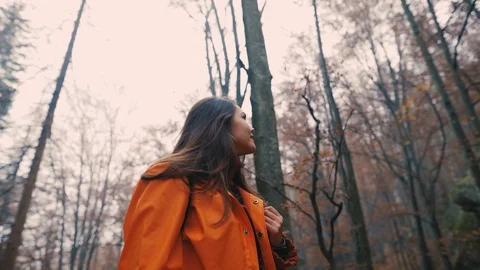 Cute young woman stand looking up in for... | Stock Video | Pond5