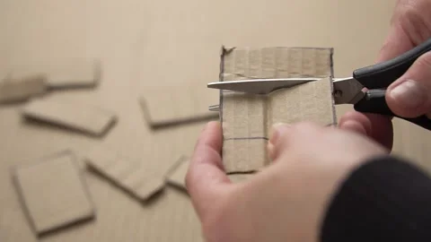 Cutting cardboard into strips along the ... | Stock Video | Pond5