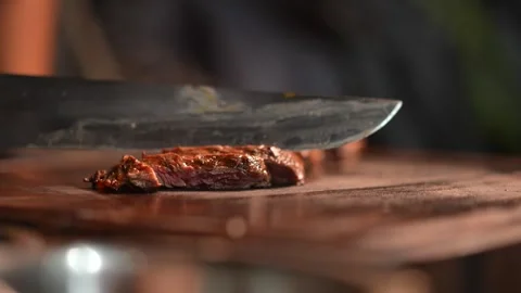 Cutting cooked meat with a knife, close ... | Stock Video | Pond5