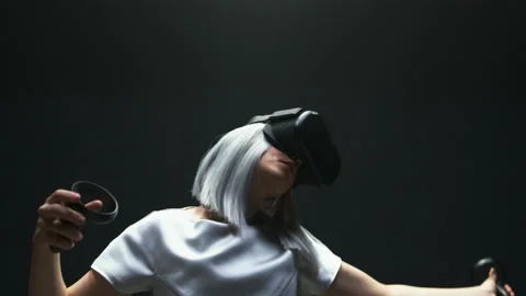 Cyberpunk girl playing vr in blinking li... | Stock Video | Pond5