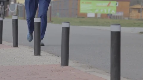 Cyclist riding and road runner male legs... | Stock Video | Pond5