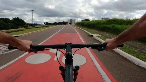 Cyclist on urban bike path with safety s... | Stock Video | Pond5