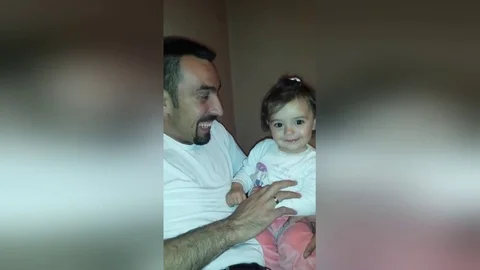 Dad and baby daughter trade funny faces ... | Stock Video | Pond5