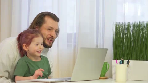 Dad and daughter at the laptop. A man an... | Stock Video | Pond5
