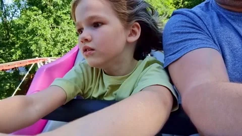 dad and daughter ride extreme attraction... | Stock Video | Pond5