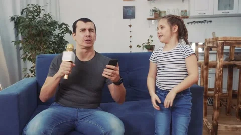 dad and daughter sing dancing at home. s... | Stock Video | Pond5