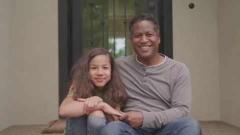 Dad And Daughter Sit On Front Porch Toge... | Stock Video | Pond5
