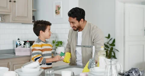 Dad washing dishes, teaching kid and cle... | Stock Video | Pond5