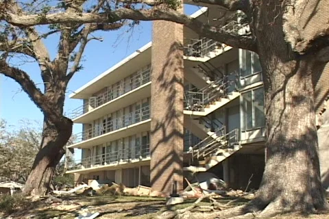 A damaged apartment building shows the d... | Stock Video | Pond5