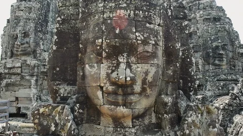 Damaged face sculptures on structures by... | Stock Video | Pond5