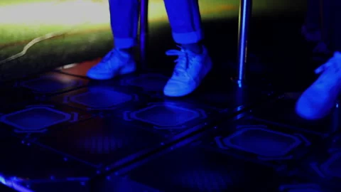 Dancers competing on a glowing Step Revo... | Stock Video | Pond5