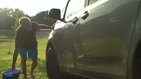 Dancing funny man washing car with backl... | Stock Video | Pond5
