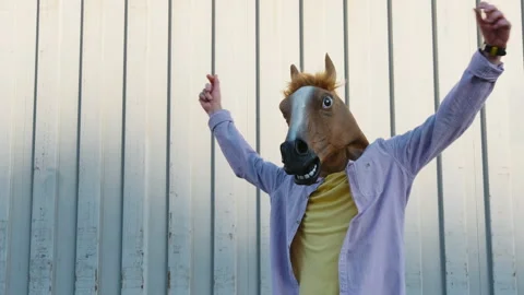 Dancing Funny Young Man in a Horse Mask ... | Stock Video | Pond5