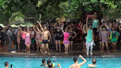 Dancing pool party on luxury resort on t... | Stock Video | Pond5