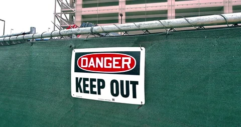 "Danger, Keep Out" sign on the fence of ... | Stock Video | Pond5