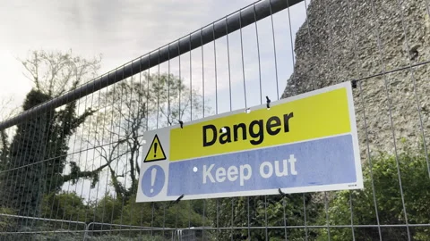 Danger Keep out sign on a fence | Stock Video | Pond5