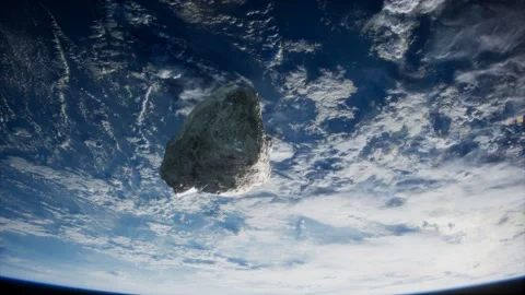 Dangerous asteroid approaching planet Ea... | Stock Video | Pond5
