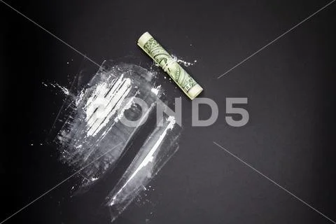 The Dangerous Cocaine with one dollar. Heroine on black background ...