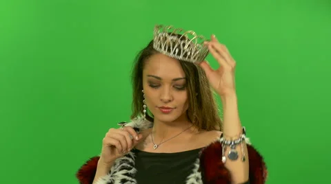 Daring beautiful girl wears a crown | Stock Video | Pond5