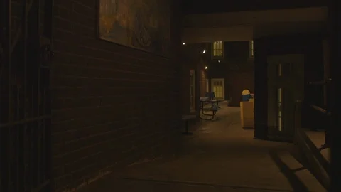 Dark Alley With Benches Behind Fence | Stock Video | Pond5