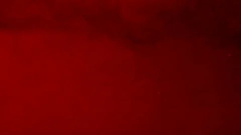 Dark red powder in liquid with bubbles. ... | Stock Video | Pond5